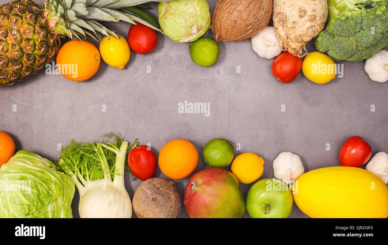 Healthy life frame with fresh organic fruits and vegetables on dark ...