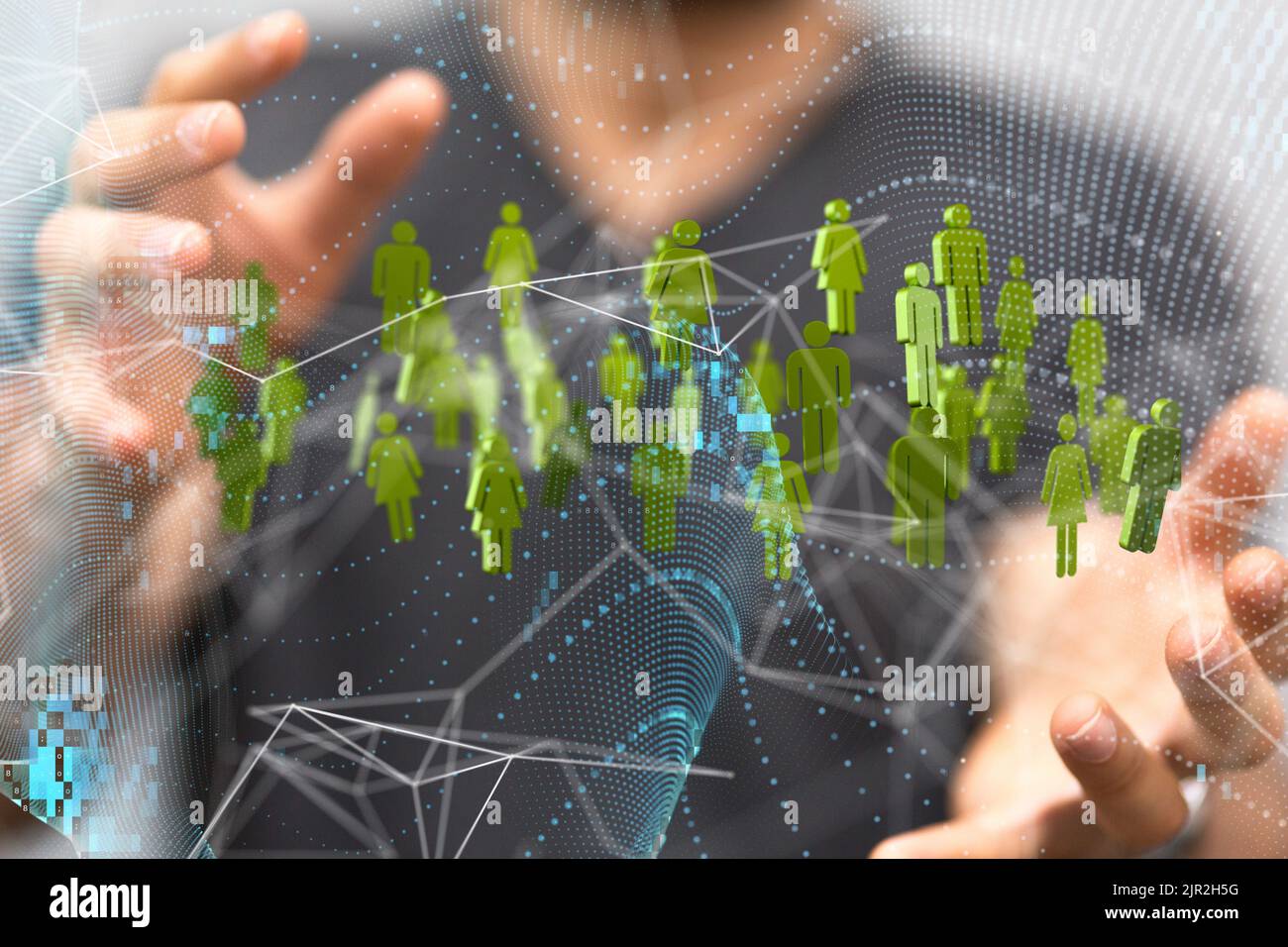 The digital people icons hovering between hands Stock Photo - Alamy