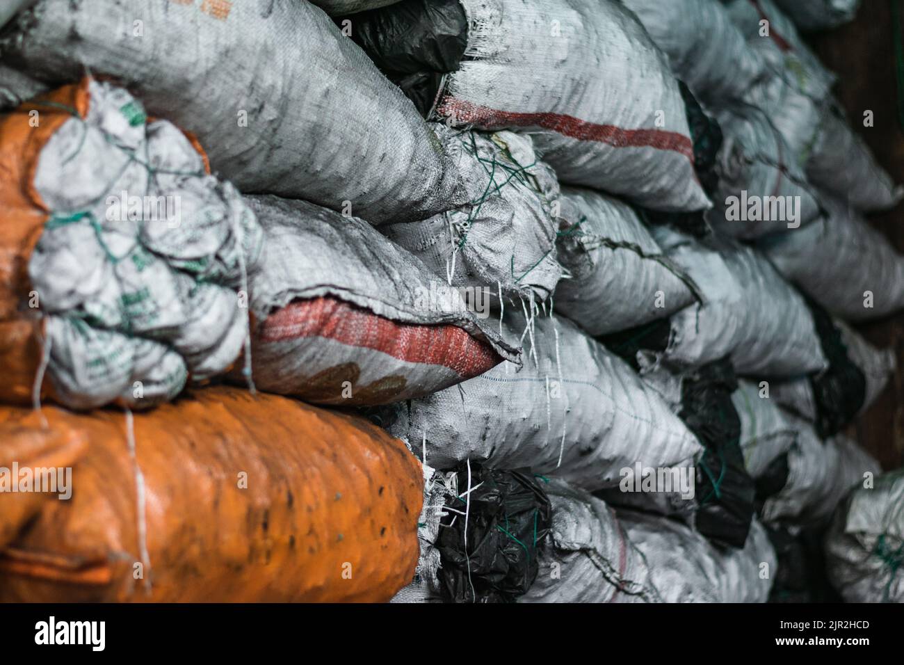 white and orange sacks filled with material and products inside a ...