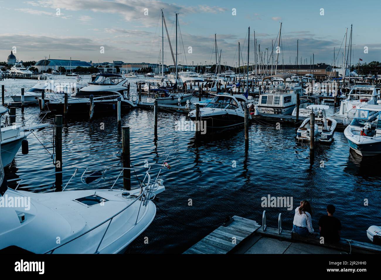A scenic view of a port in Annapolis with boats under the blue sky ...