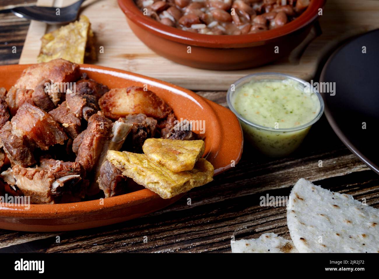 Traditional colombian food with fried meat and black beans Stock Photo ...