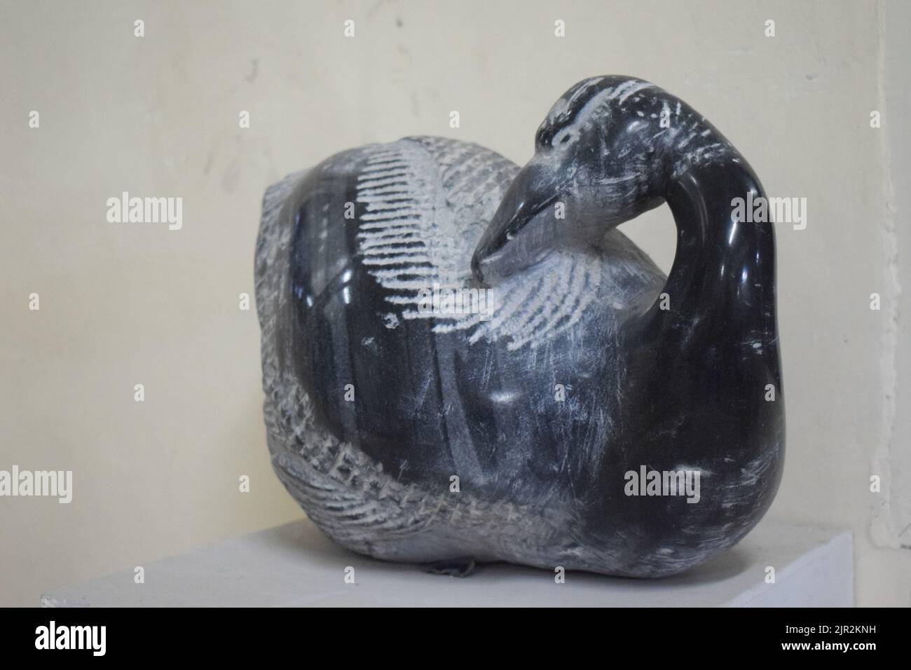 Sculpture of swan which is made from black stone Stock Photo - Alamy