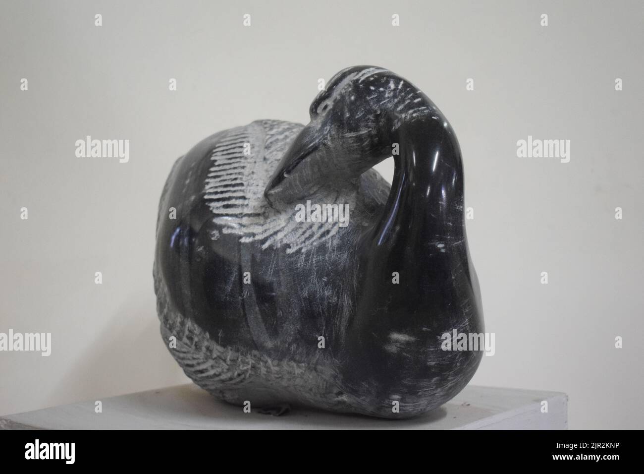 Sculpture of swan which is made from black stone Stock Photo - Alamy