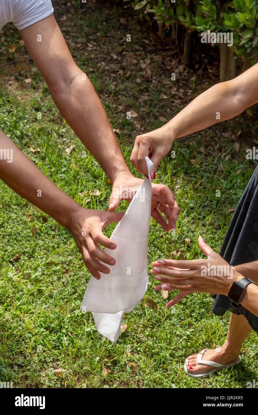 A flag-stealing game action with the hands of two players trying to ...
