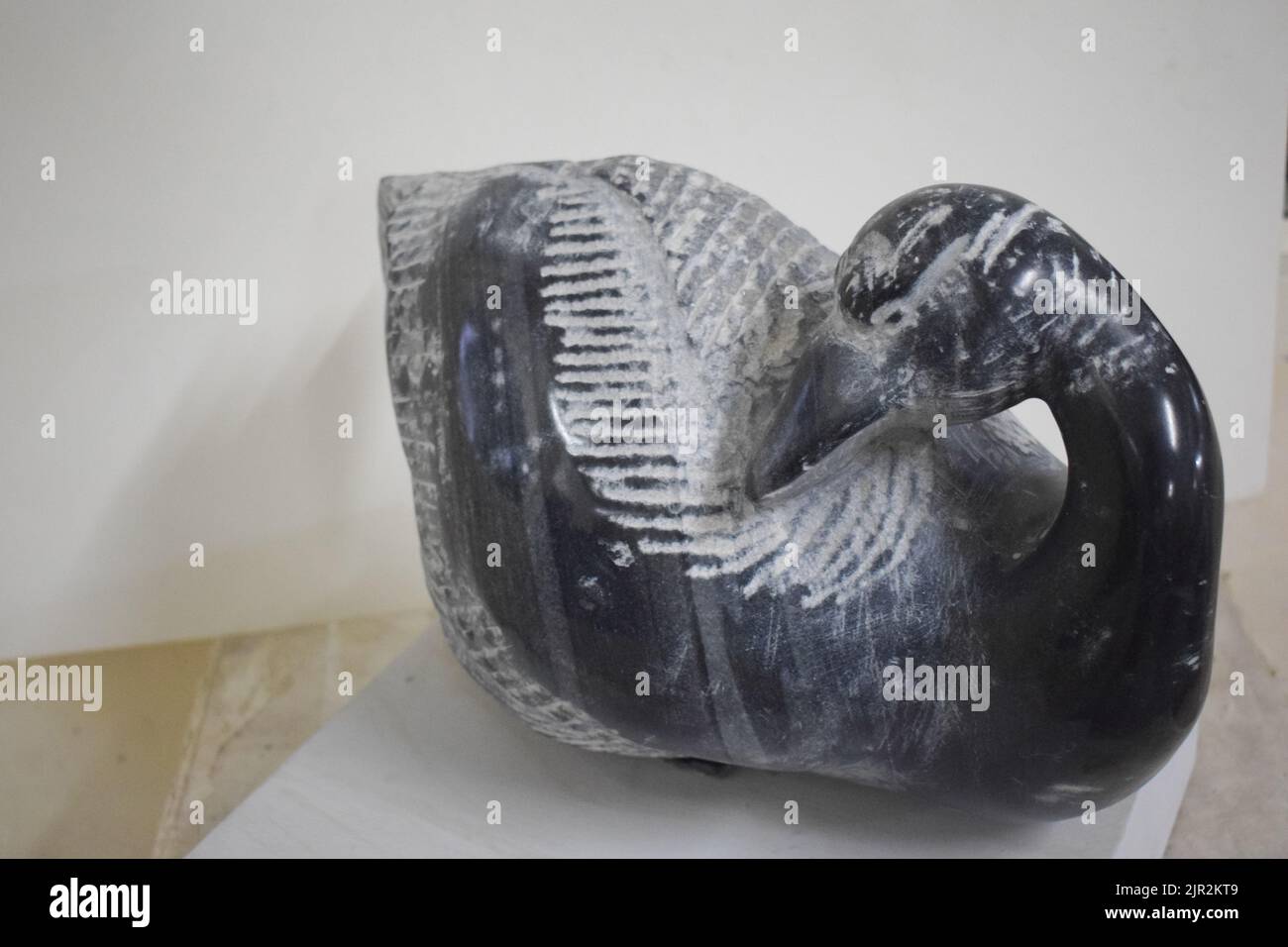 Sculpture of swan which is made from black stone Stock Photo - Alamy