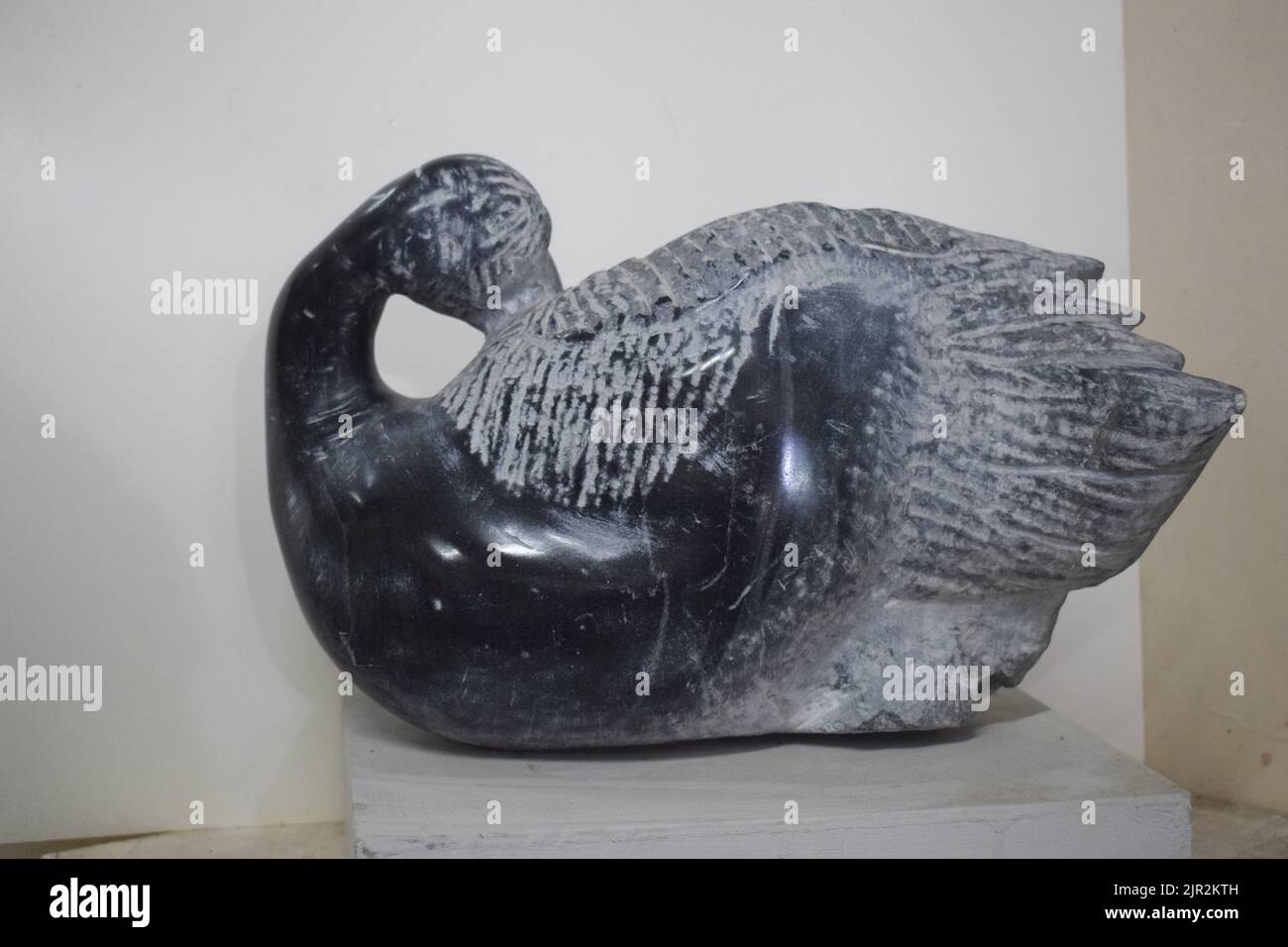 Sculpture of swan which is made from black stone Stock Photo - Alamy