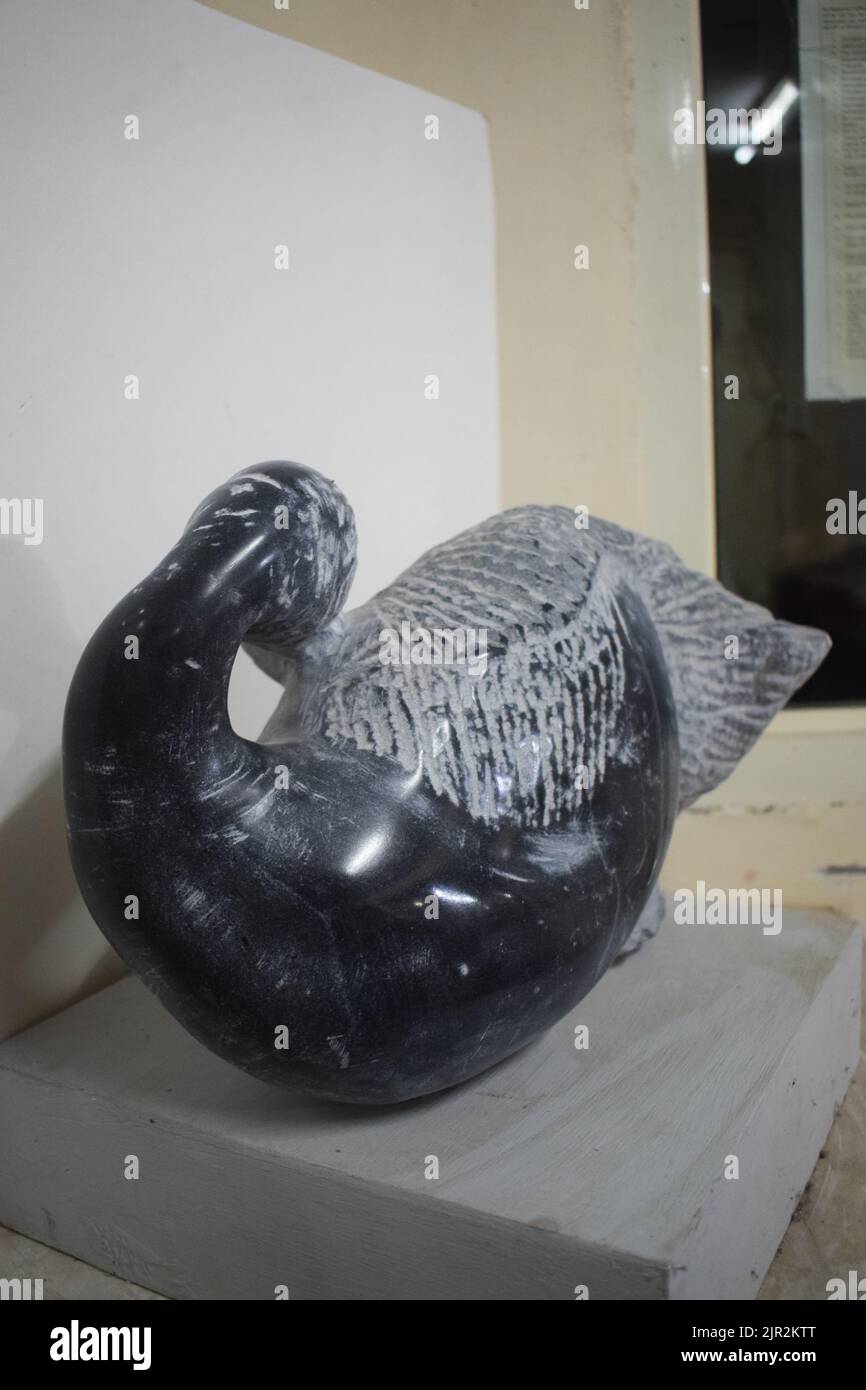 Sculpture of swan which is made from black stone Stock Photo - Alamy