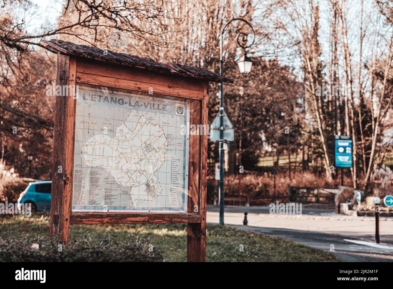 A selective focus of a wooden board showing a city map with blurred ...