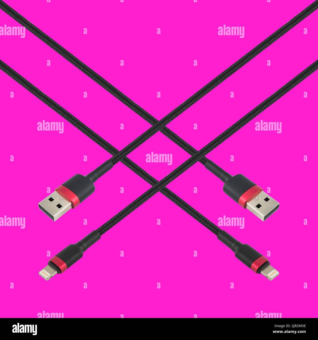 Cable with USB and Lightning connector, isolated on a red background ...