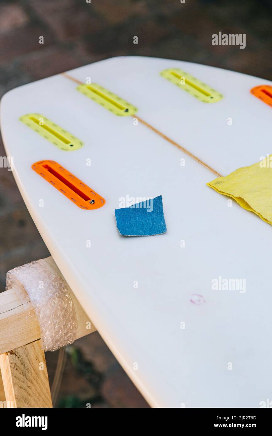Rear shot of a surfboard with a small bump Stock Photo - Alamy