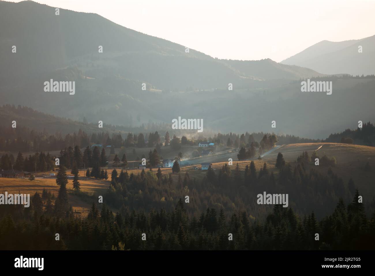 Magic summer sunset over the mountain village at Tihuta, Piatra ...