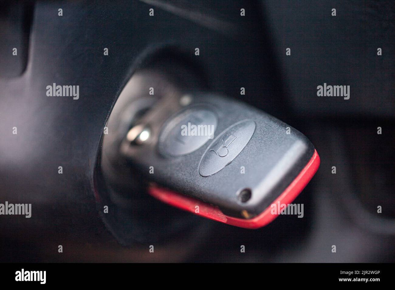 Ignition key of modern car close up. Car key in keyhole Stock Photo - Alamy