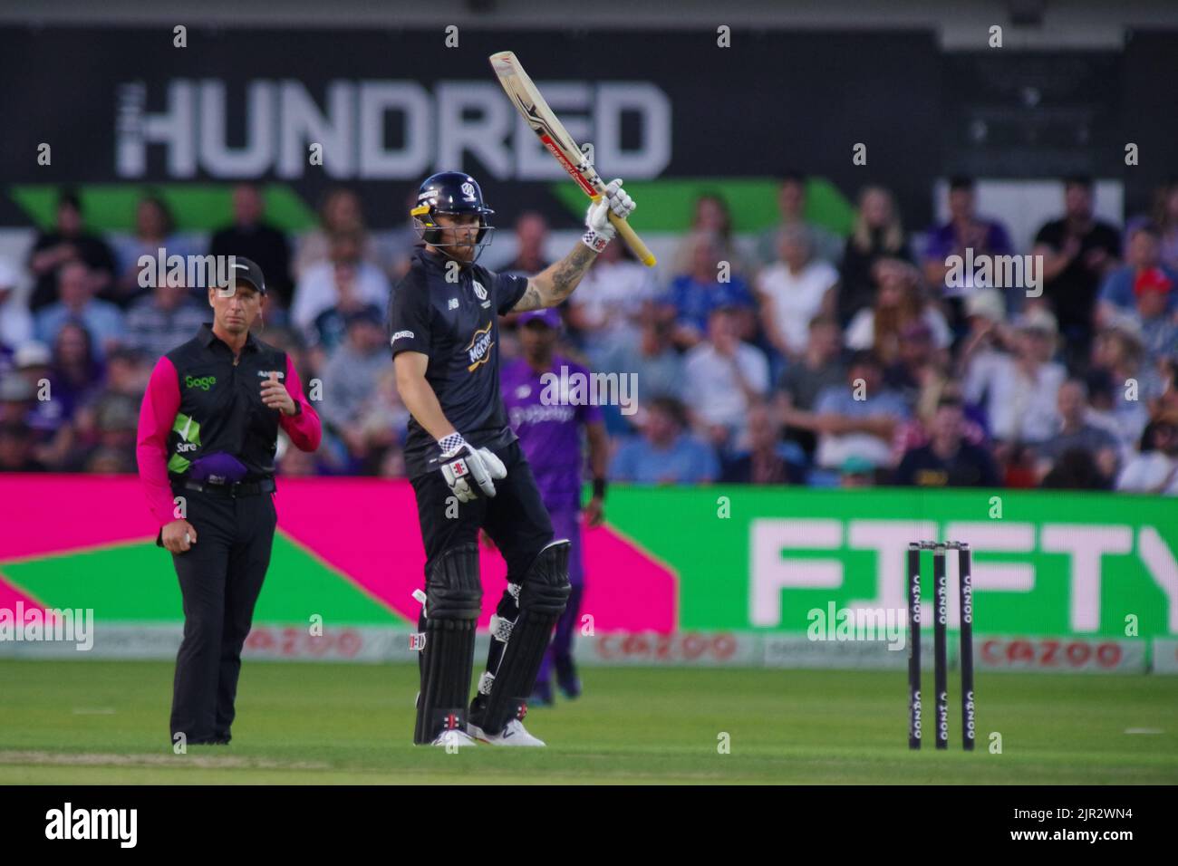 Cricket batsman raising bat hi-res stock photography and images - Alamy