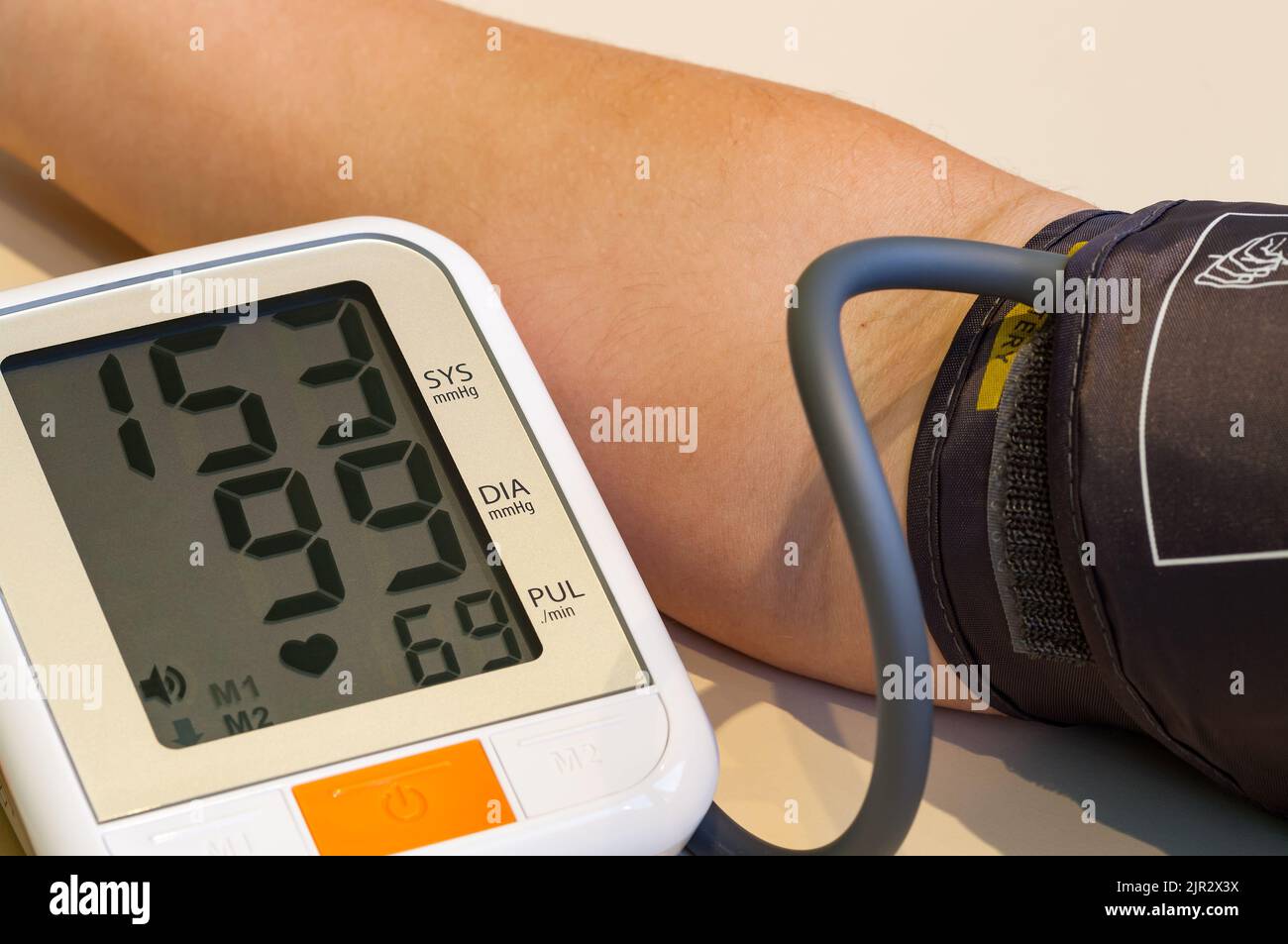 Measuring blood pressure close-up. high blood pressure Stock Photo - Alamy