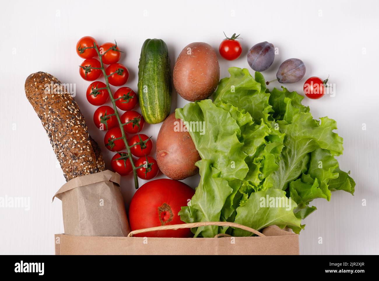 Paper bag with different groceries on white background Stock Photo - Alamy