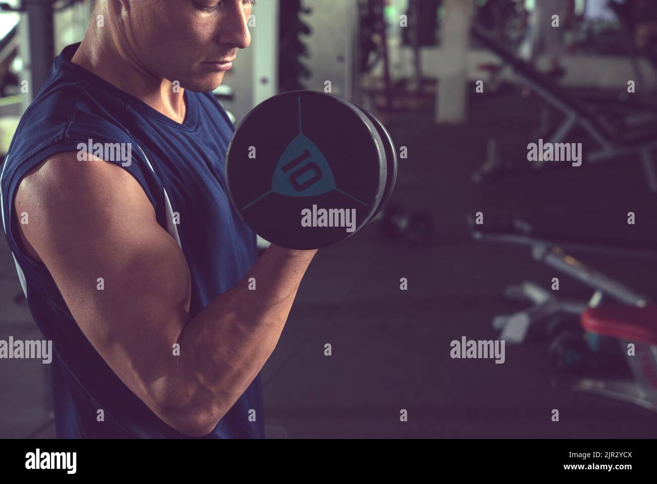 Cropped image of man training with dumbbell Stock Photo - Alamy