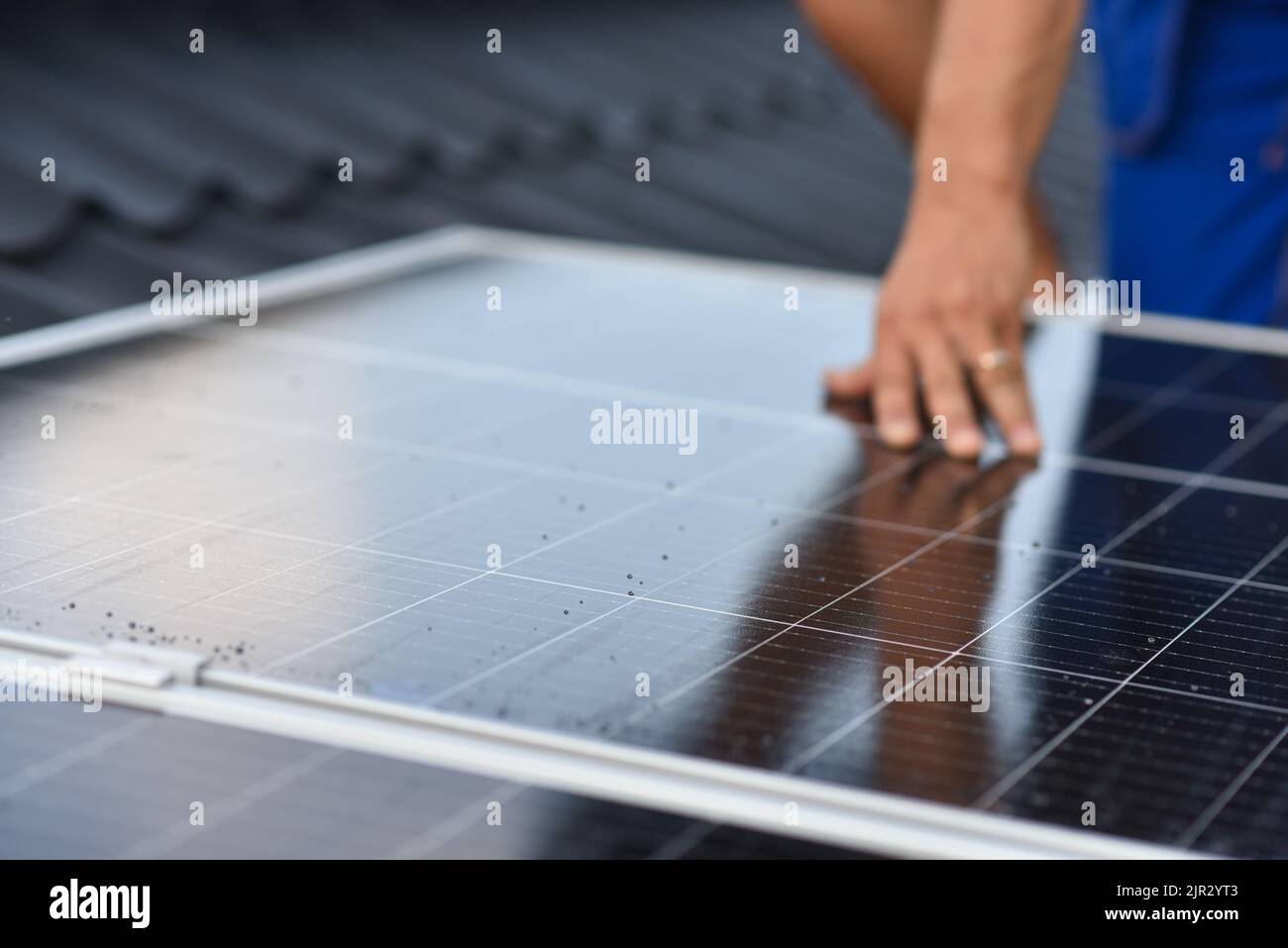 Rooftop solar power system. Process of installing solar panels on the ...