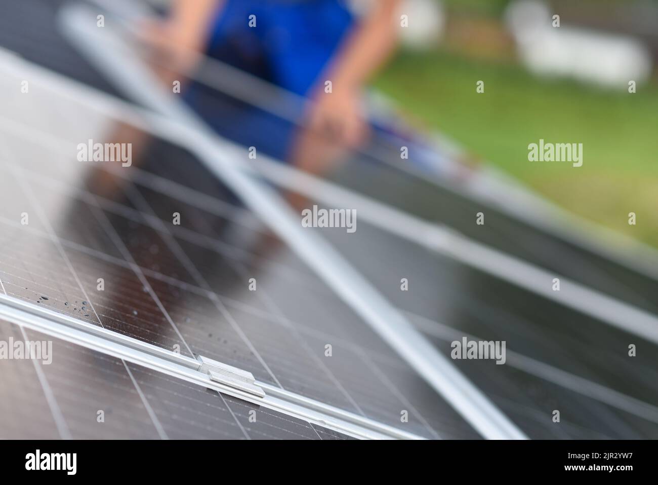 Rooftop solar power system. Process of installing solar panels on the ...