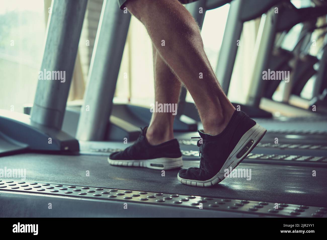 Man running on treadmill warming hi-res stock photography and images ...