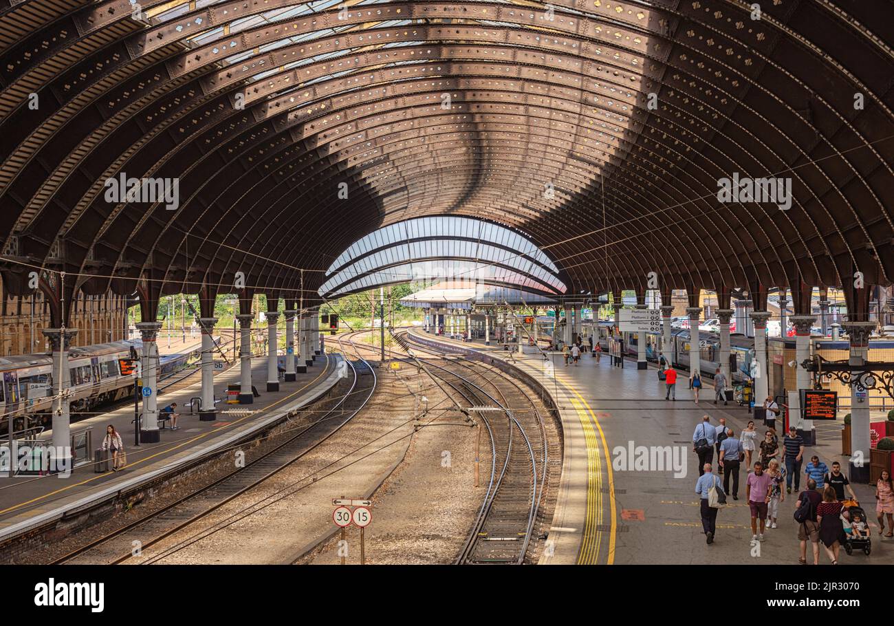 Panoramic view of a railway station covered by a curving 19th Century ...