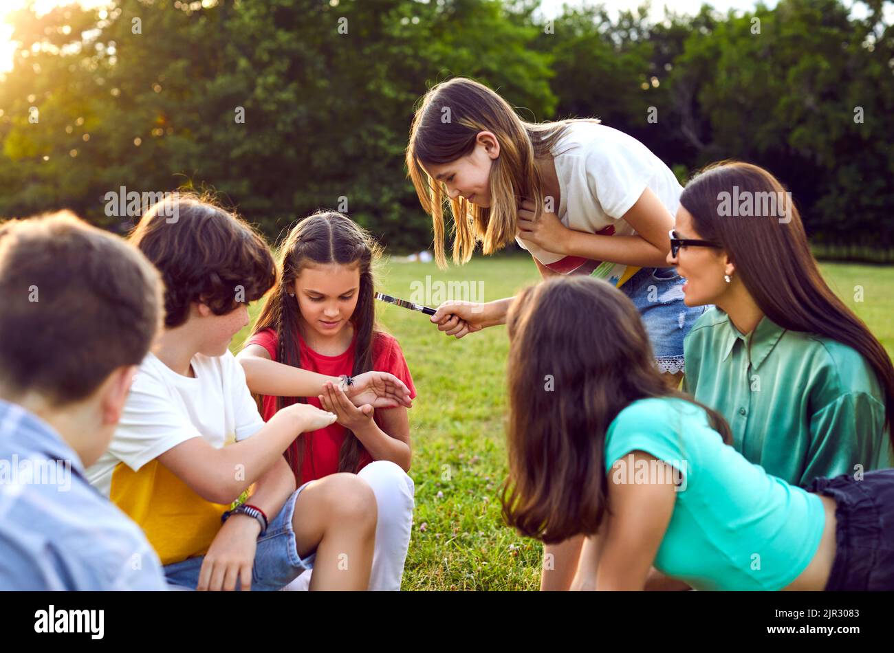Group of happy little children playing games, dancing and having fun in ...