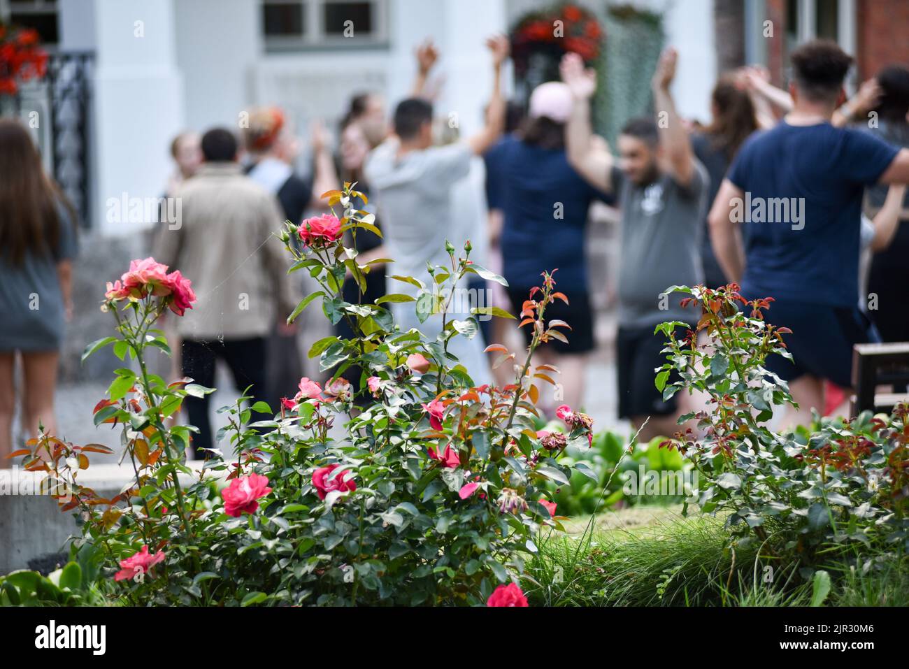 Young people dancing and having fun in the park. Latvia - Luznava, 08. ...