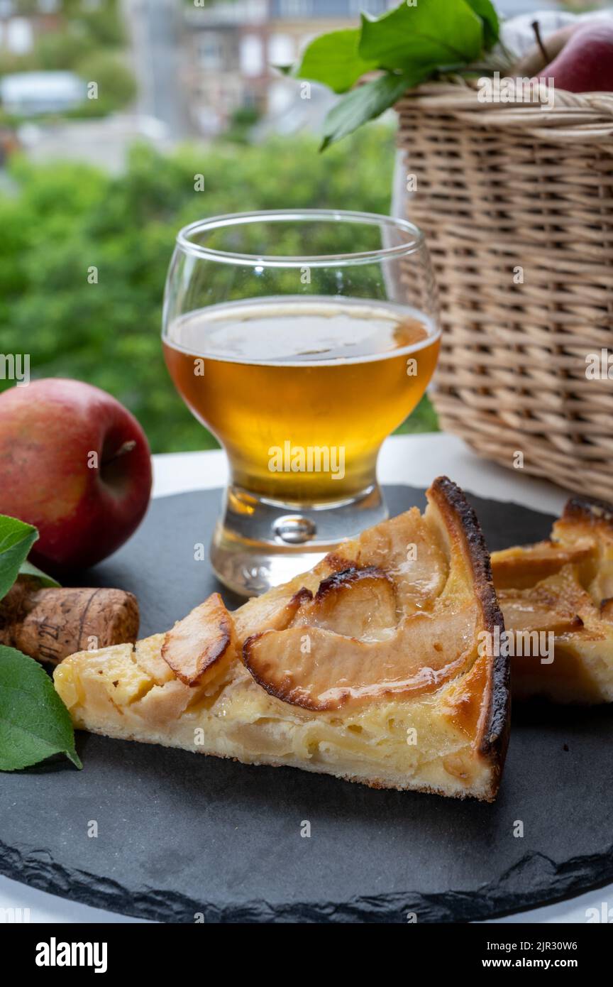 Apple products of Normandy region, homemade baked apple cake, glass of ...