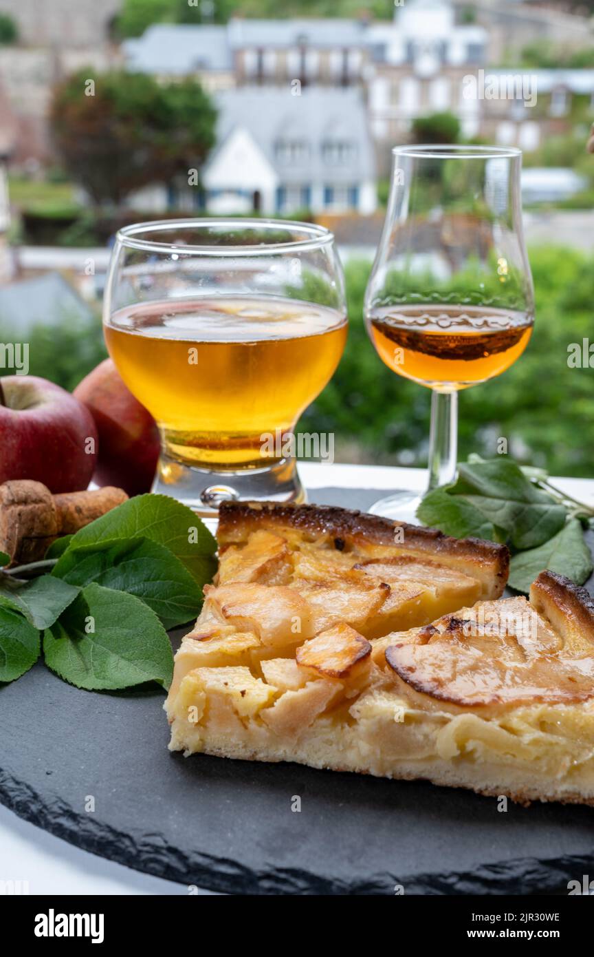 Apple products of Normandy region, homemade baked apple cake, glasses ...