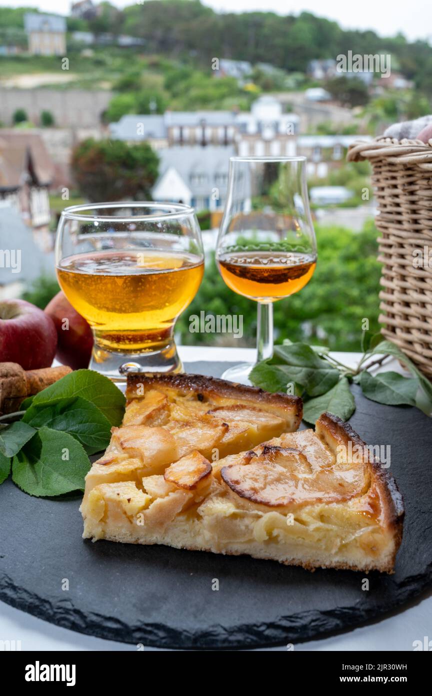 Apple products of Normandy region, homemade baked apple cake, glasses ...