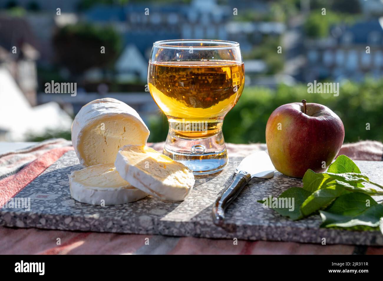 Products of Normandy, cow neufchatel lait cru cheese and glass of apple ...
