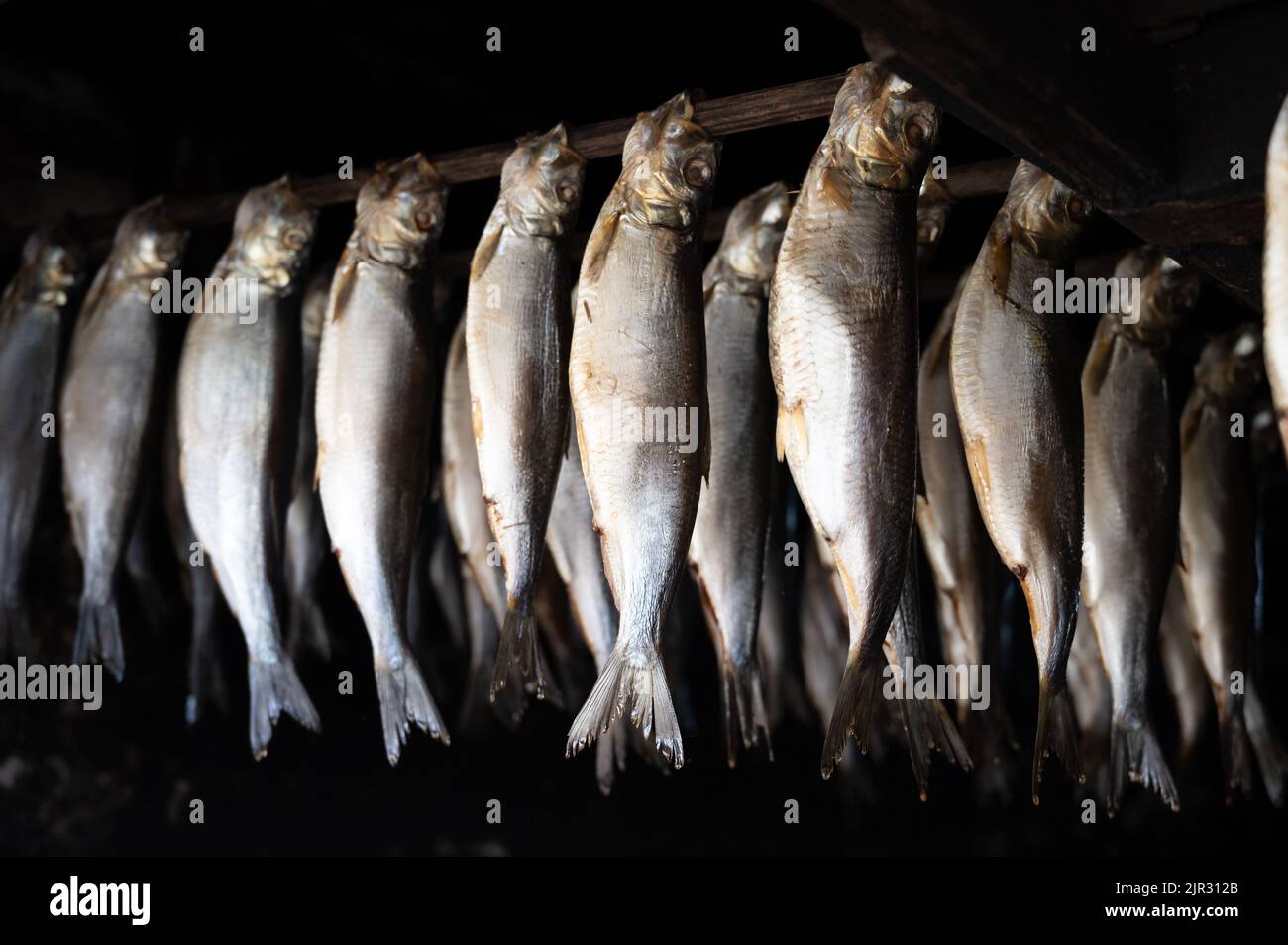 Old dark traditional Dutch smokehouse in fisherman's village in Horth ...