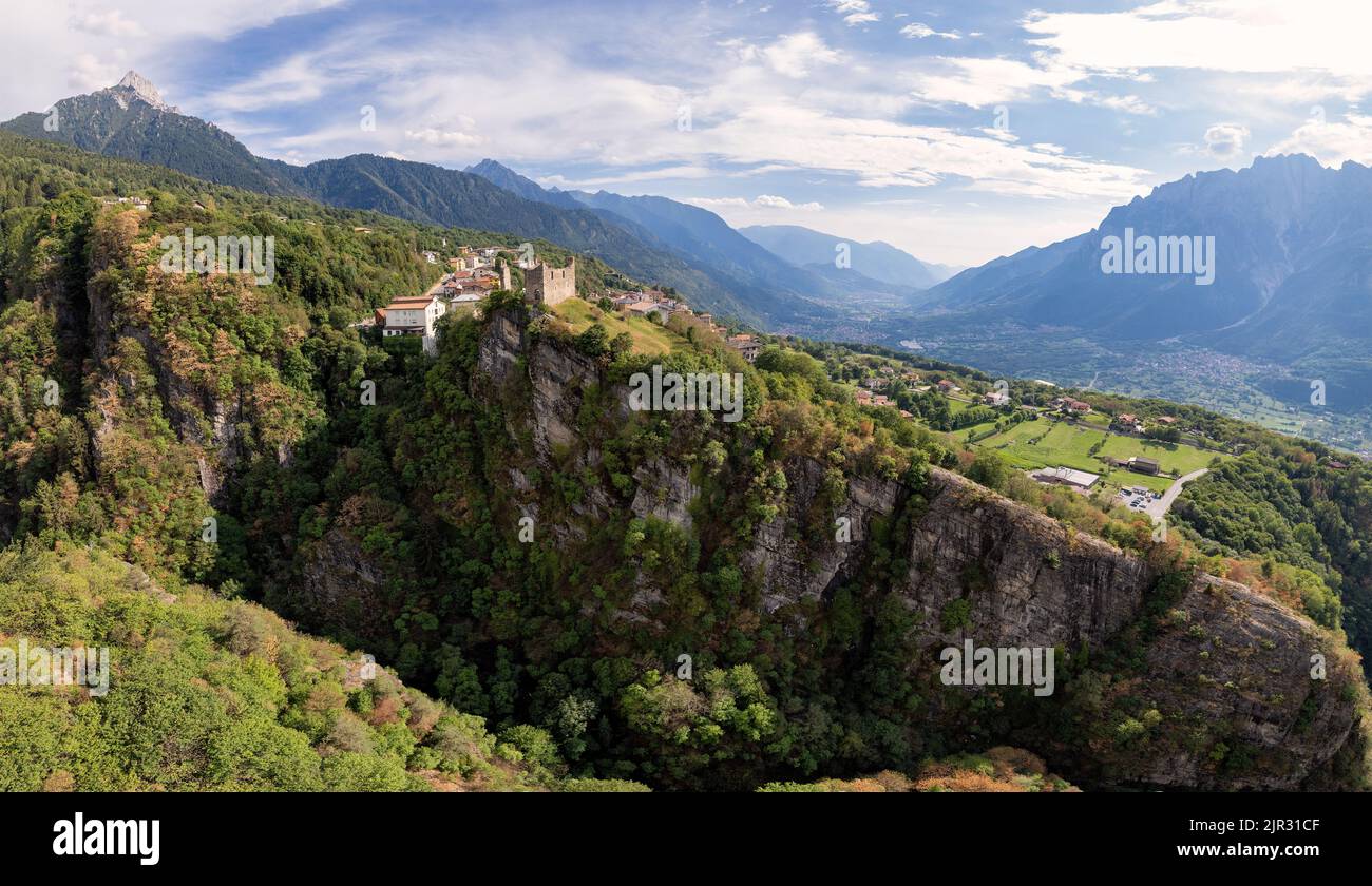 Stunning landscape of a village with old ruins located next to a cliff ...