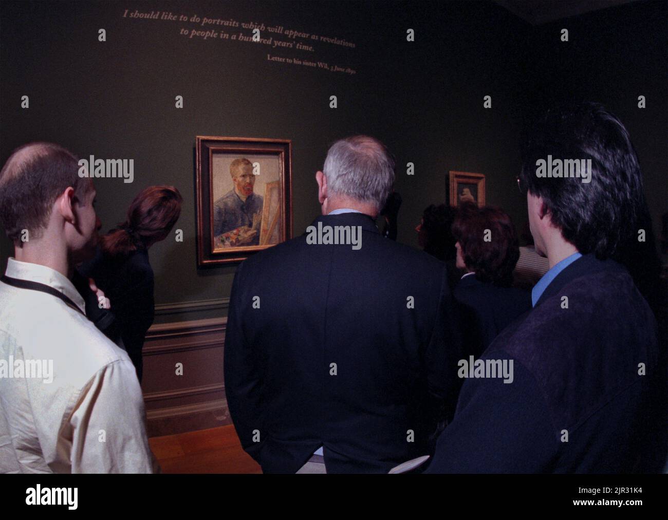 People gather around the Vincent van Gogh Self-Portrait as a Painter ...
