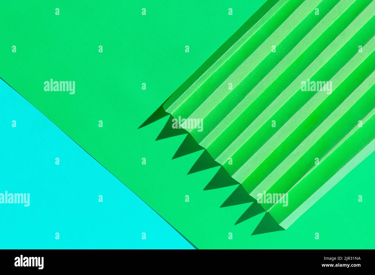 Abstract green and blue colored paper texture. Folded paper with harsh ...
