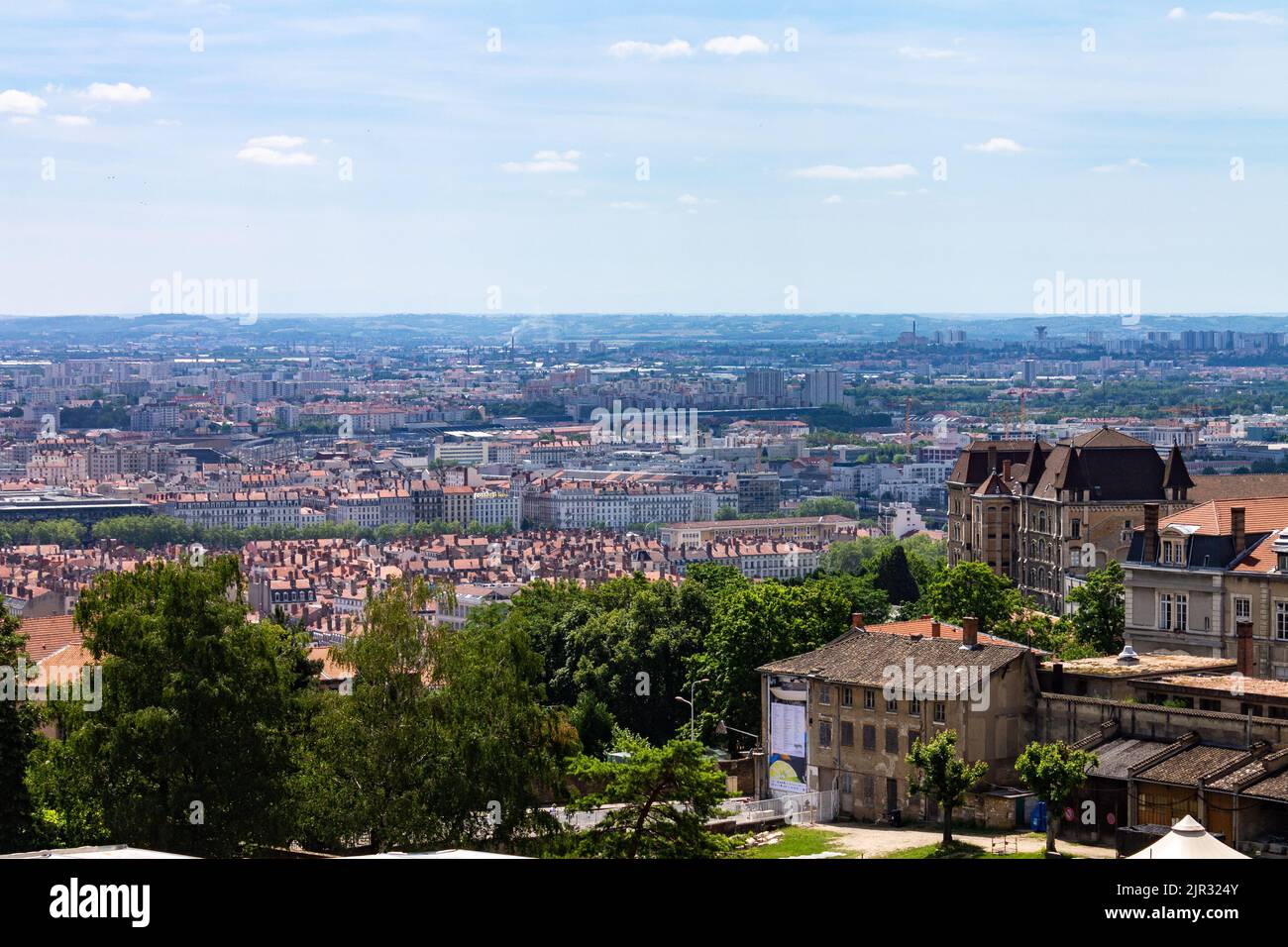 The beautiful cityscape of Lyon, the historical buildings of downtown, France with red rooftops ...