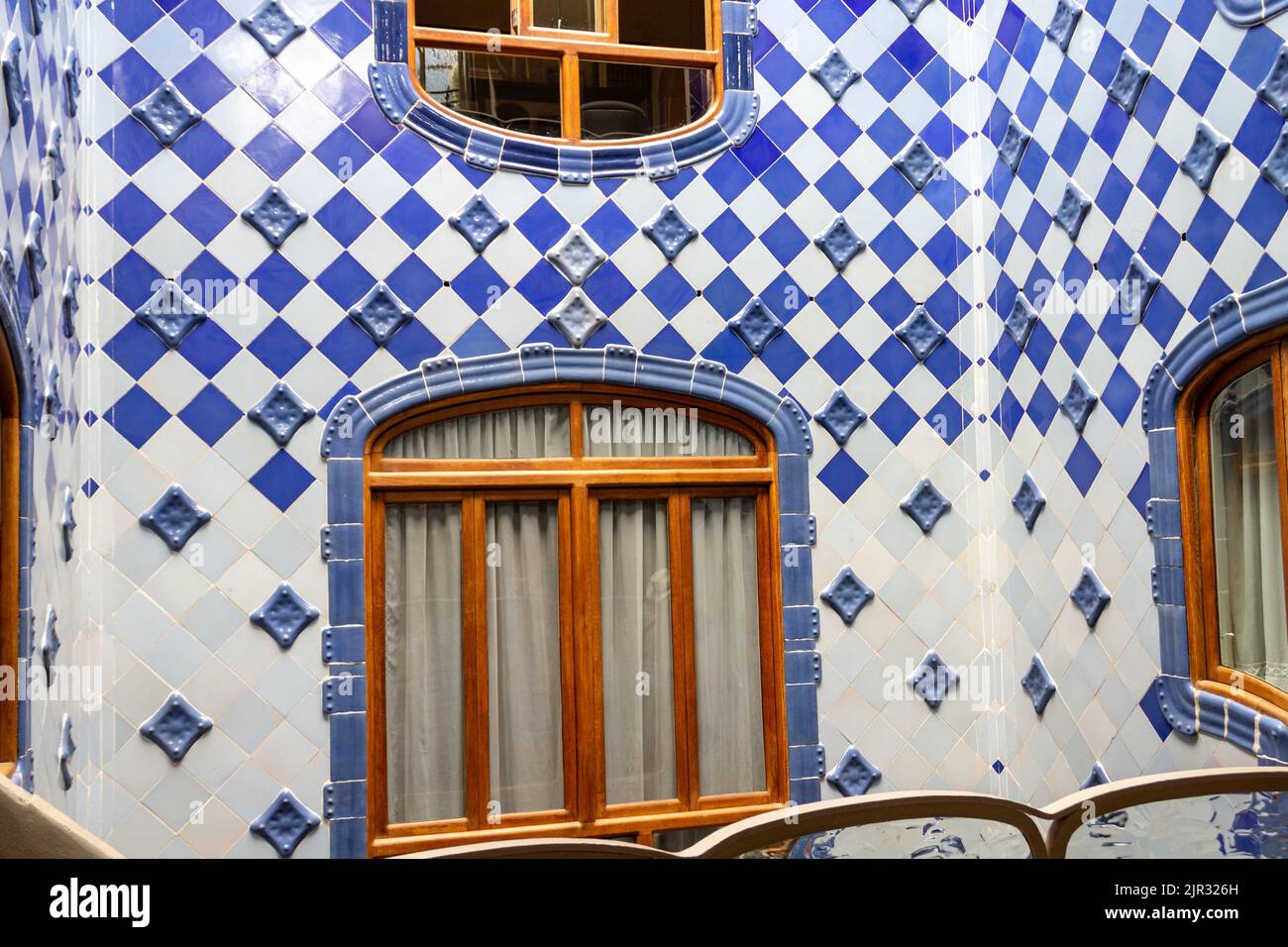 The blue tiled walls with windows in Casa Mila in Barcelona, Spain ...