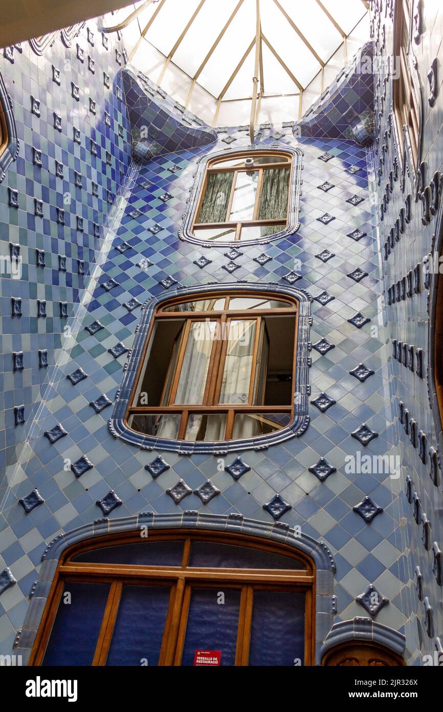 The blue tiled walls with windows in Casa Mila in Barcelona, Spain ...