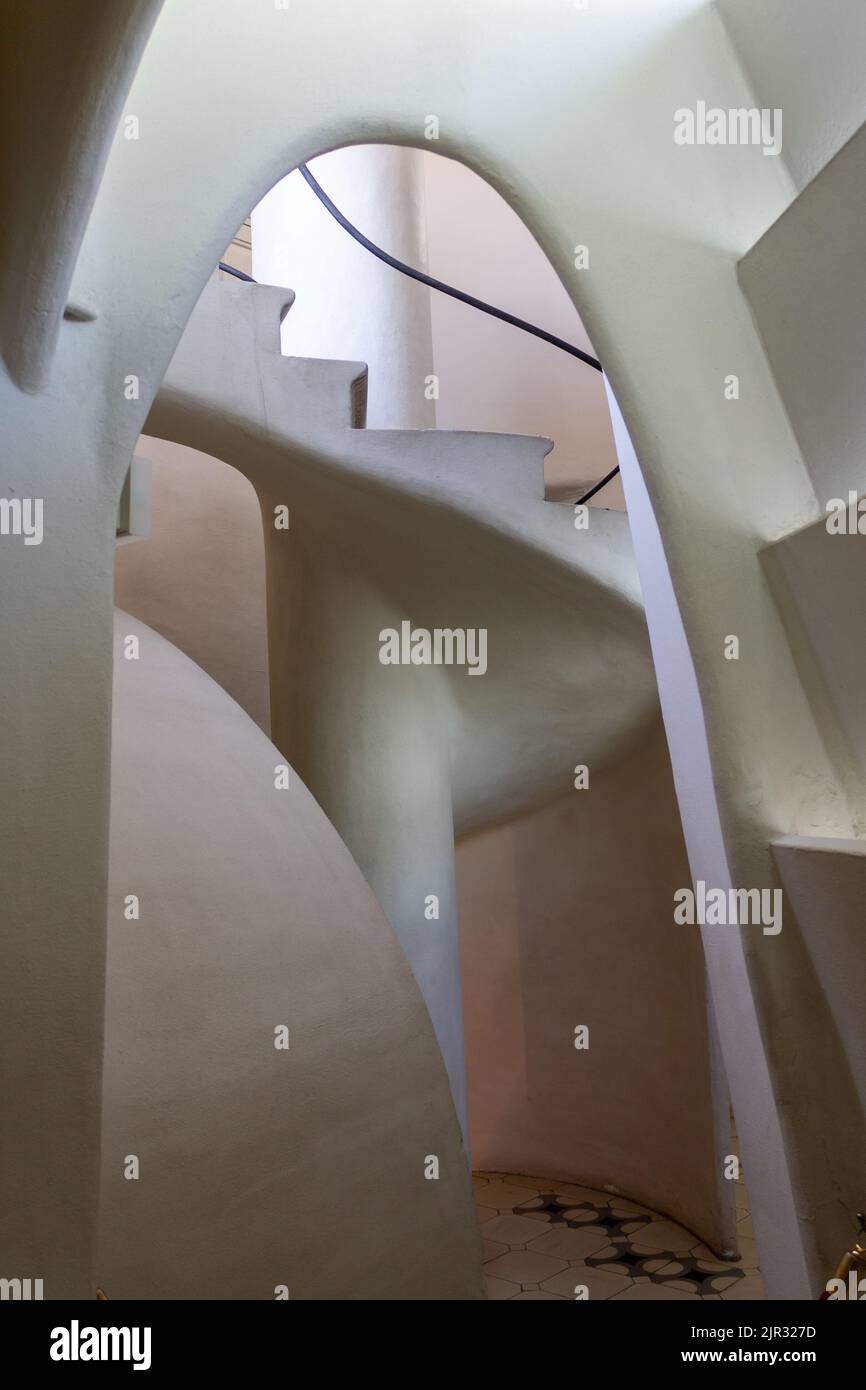 A vertical shot of the interesting interior of Casa Mila with arched ...