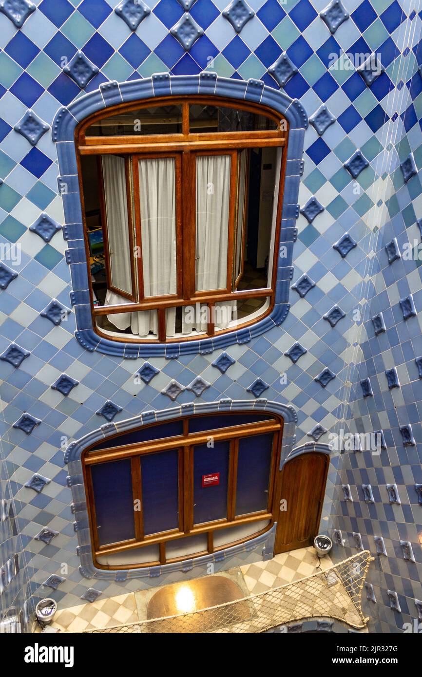 The blue tiled walls with windows in Casa Mila in Barcelona, Spain ...