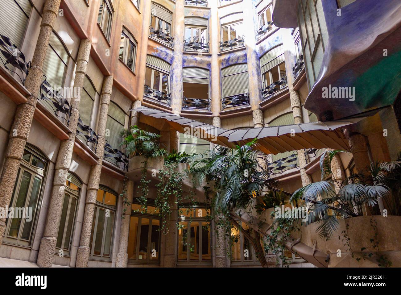 The windows to the inner garden inside Casa Mila in Barcelona, Spain ...