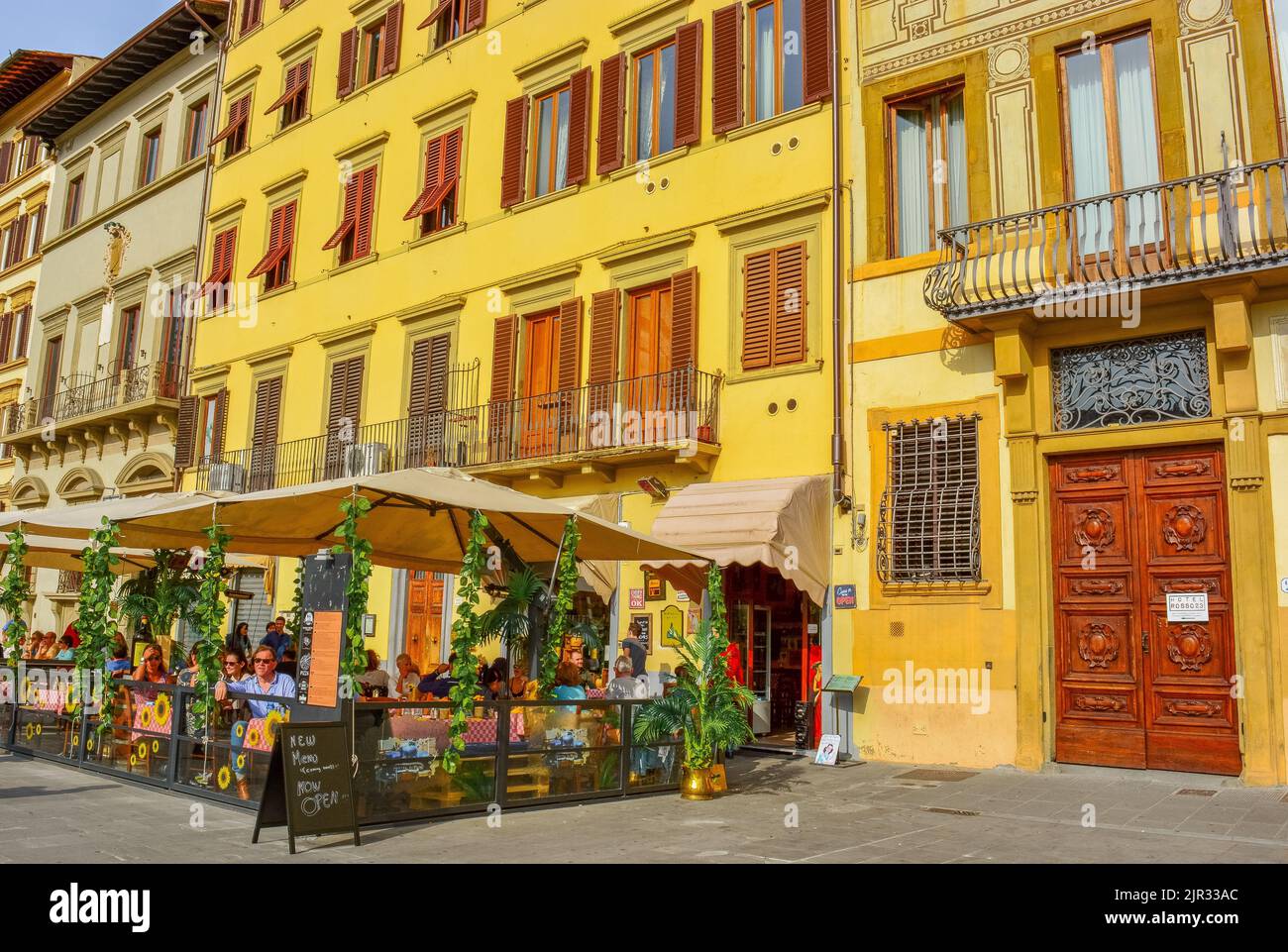 People enjoying spring days in an outdoor cafe in Florence, Italy Stock ...