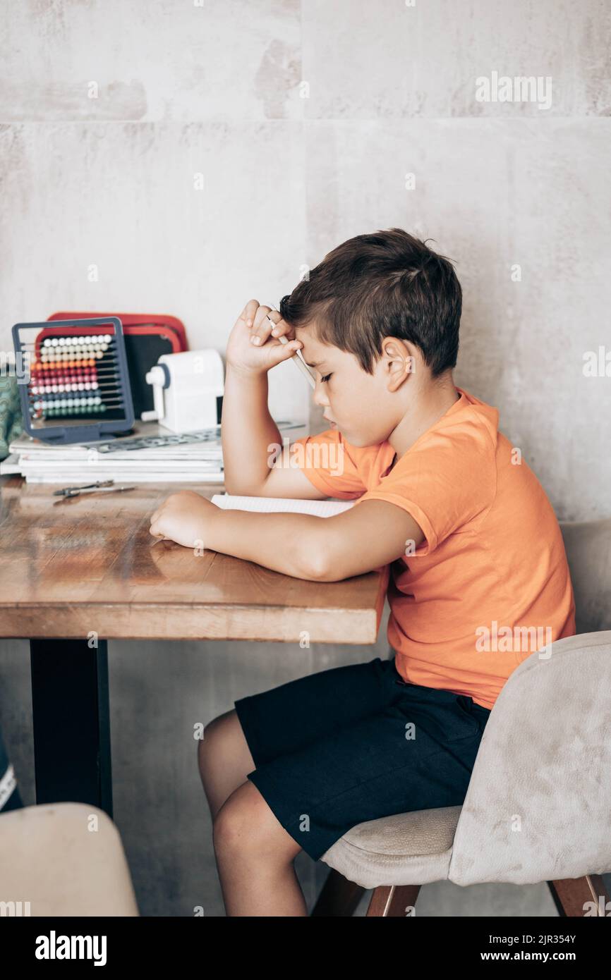 Boy table homework hi-res stock photography and images - Alamy