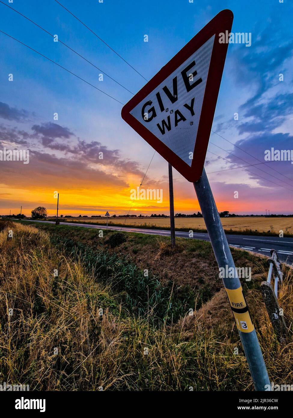Sunset at a crossroads in Norfolk Stock Photo - Alamy