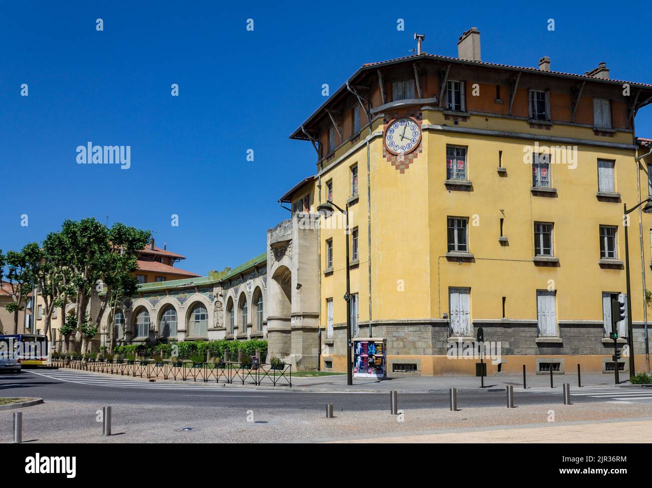 The historical building on a corner with a clock in Carcassonne ...