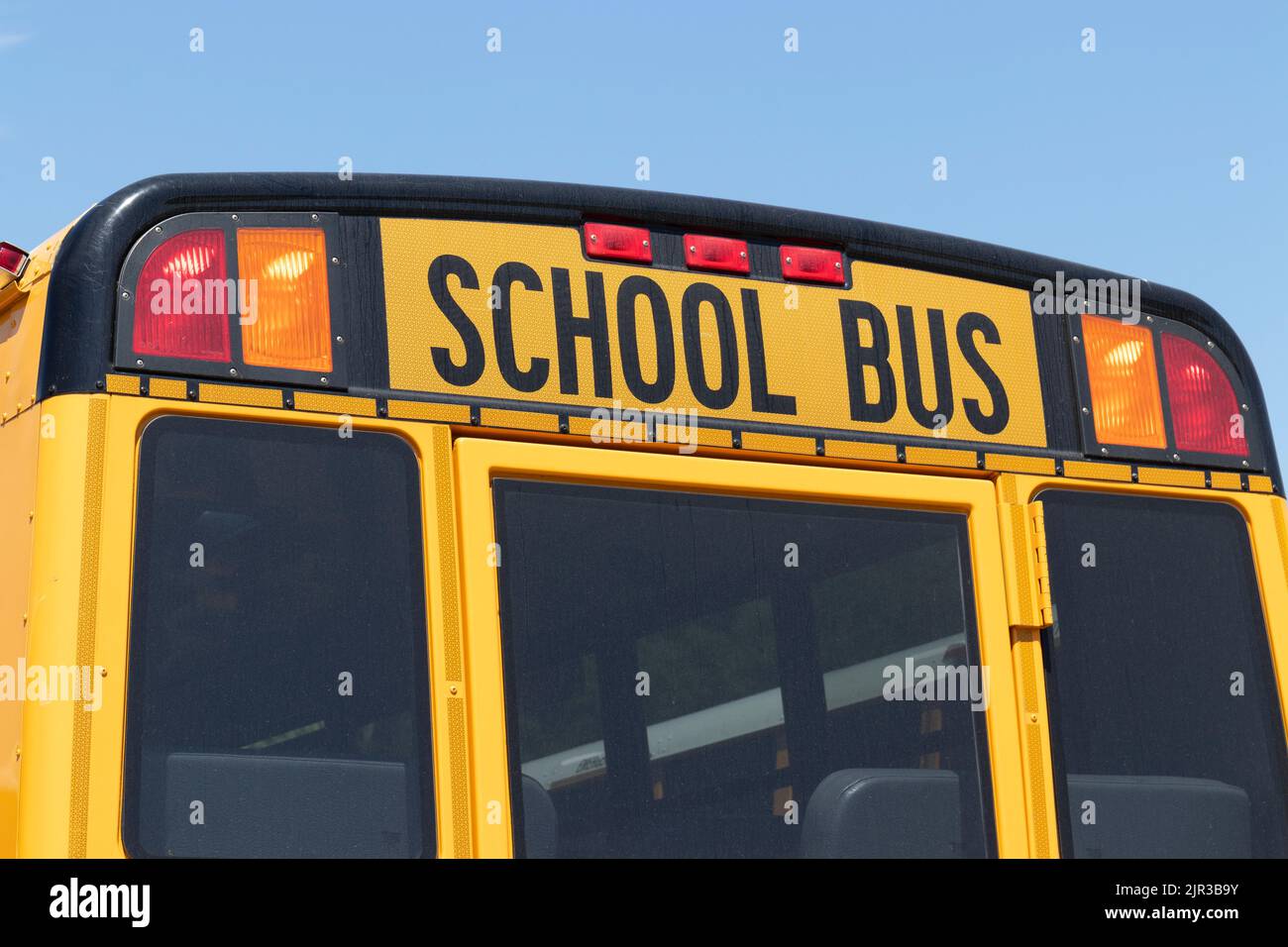 School Bus staging area waiting for students. School buses are an ...