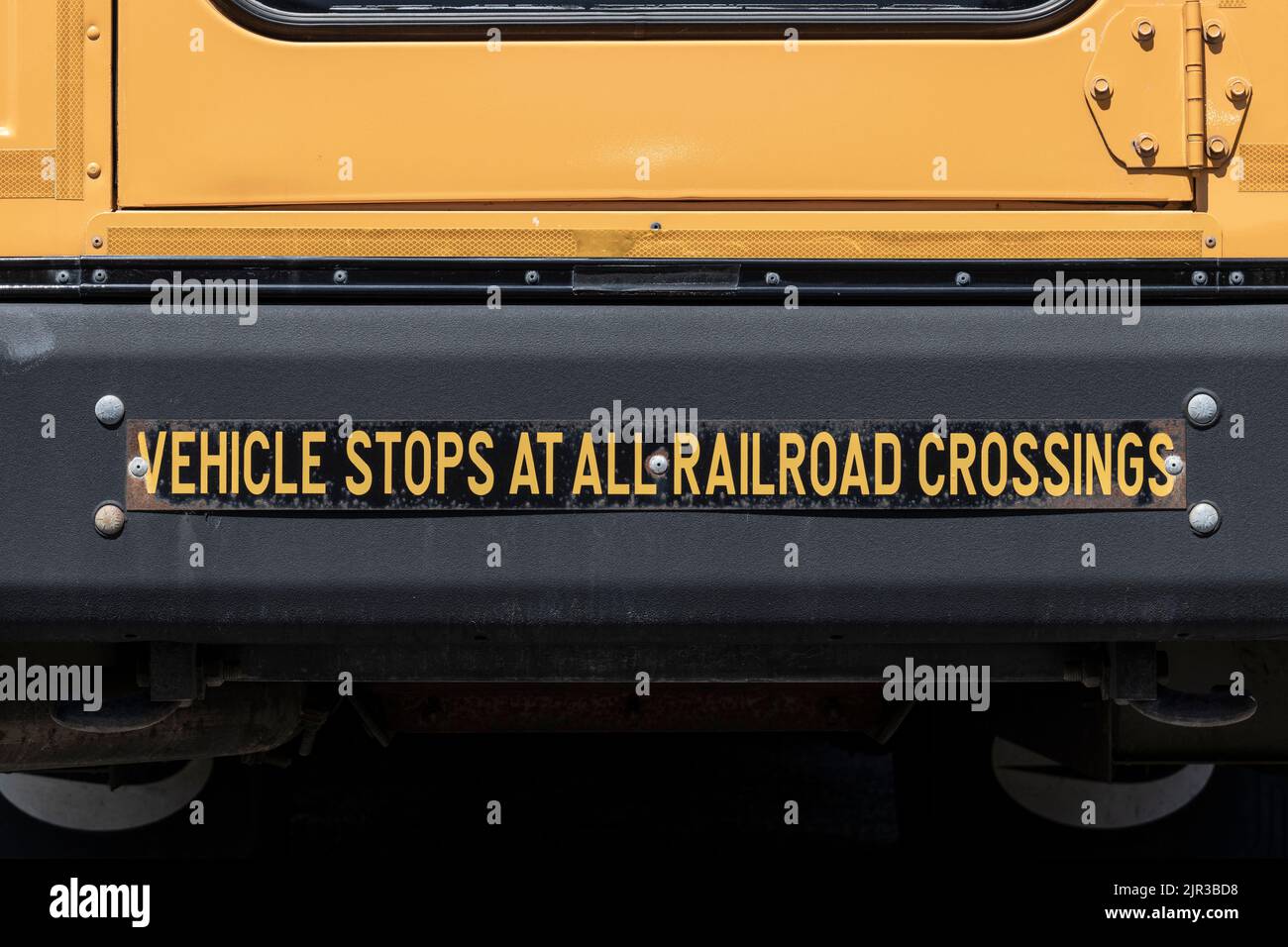 Vehicle Stops at All Railroad Crossings sign on the back of a School ...