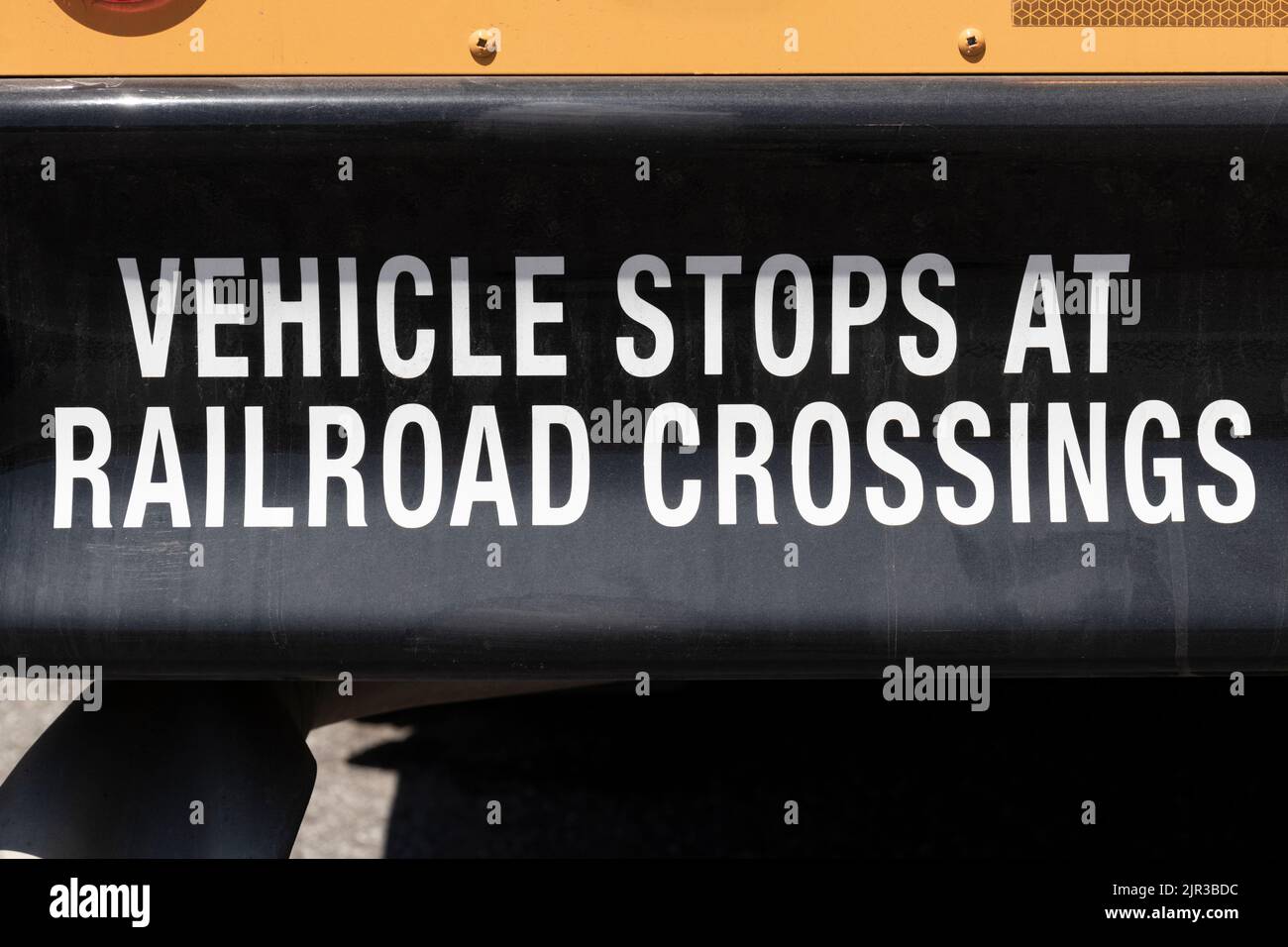 Vehicle Stops at Railroad Crossings sign on the back of a School Bus ...