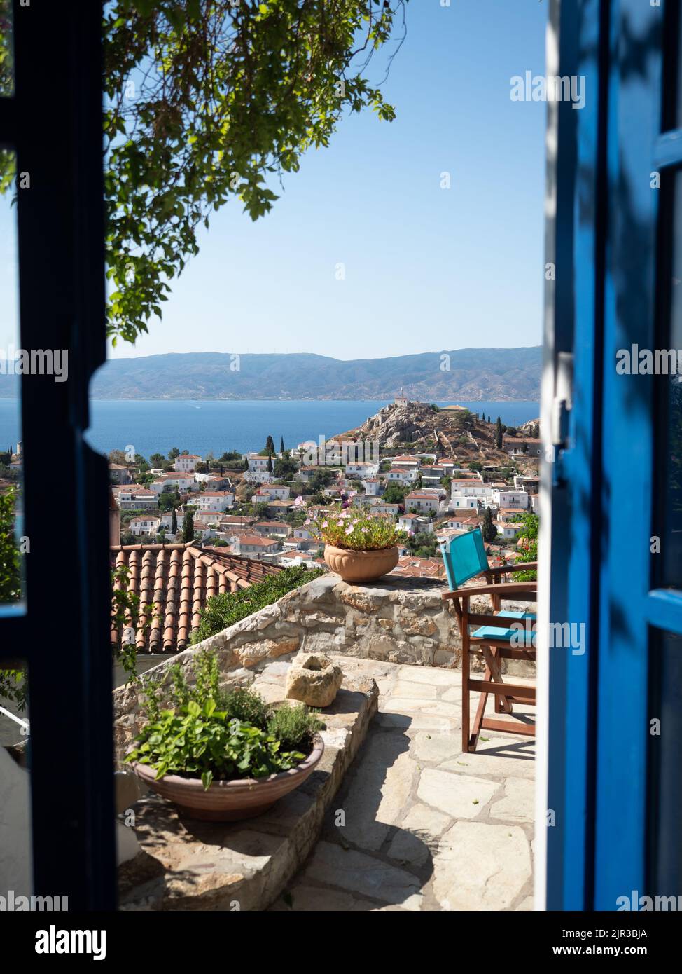 View over Greek town of Hydra, terracotta rooftops and pretty houses ...