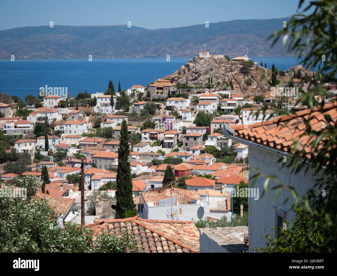 View over Greek town of Hydra, terracotta rooftops and pretty houses ...