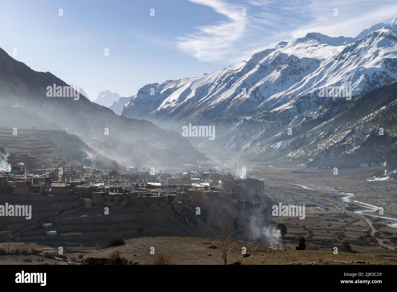 The view of Manang rocky range mountains with fog and glacier of ...